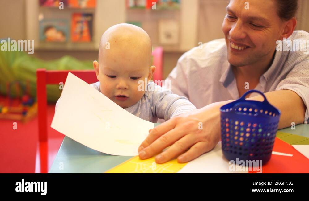 A cute kid draws with his father. Early Development Center, Father's ...