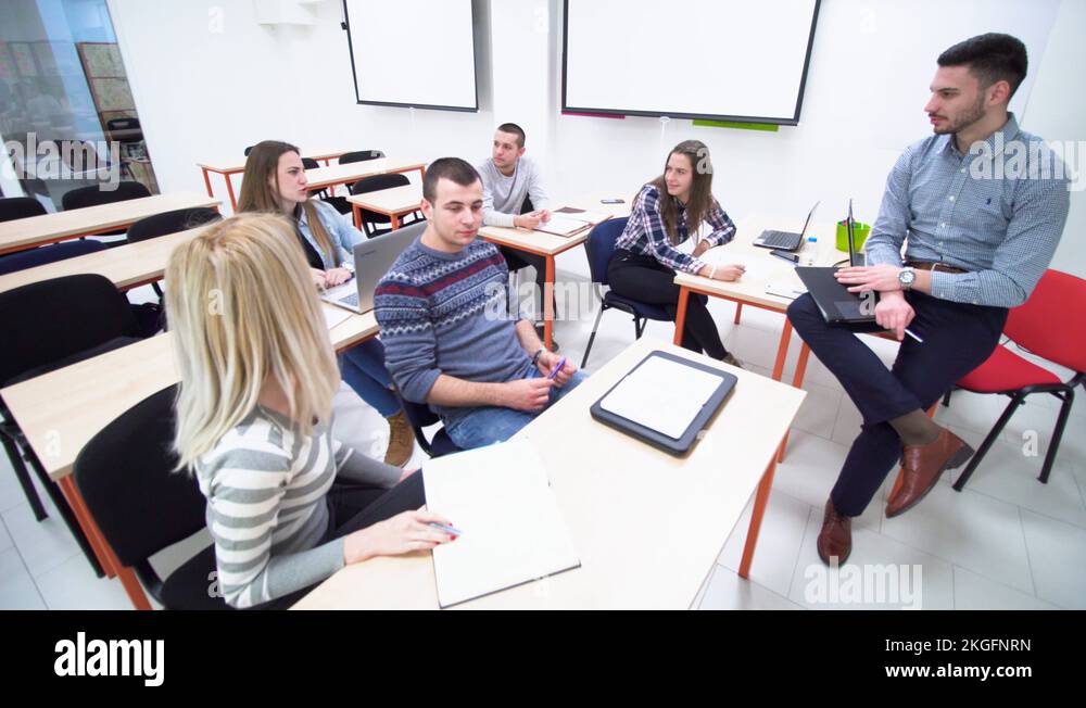 students interacting with professor in a classroom Stock Video Footage ...