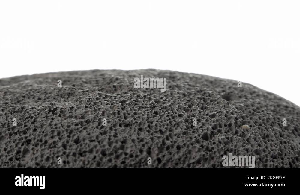 Scoria rock surface texture extreme close up against white background ...