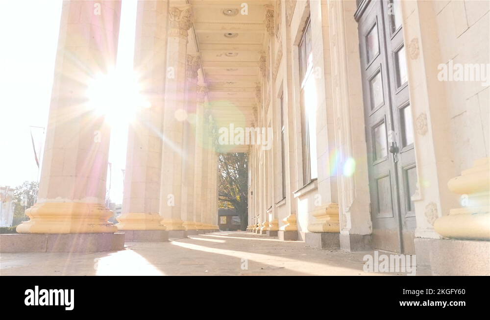 Beautiful columns. High building. Slow motion. Camera in motion. Sun ...