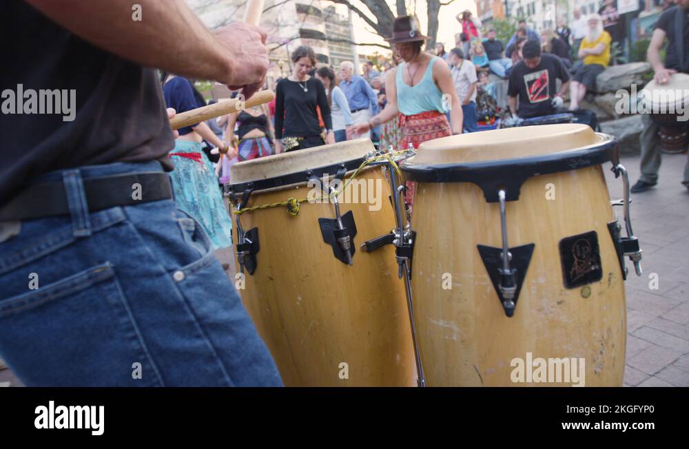 People dancing and drummers performing during the live street concert ...