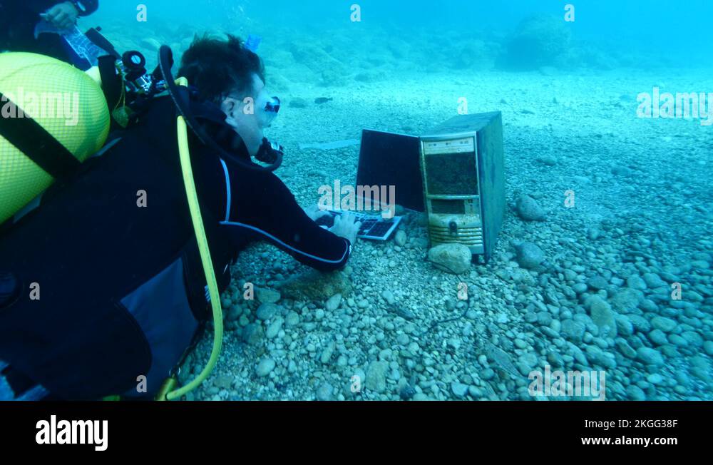scuba divers exploring underwater habitat blue ocean scenery Stock ...