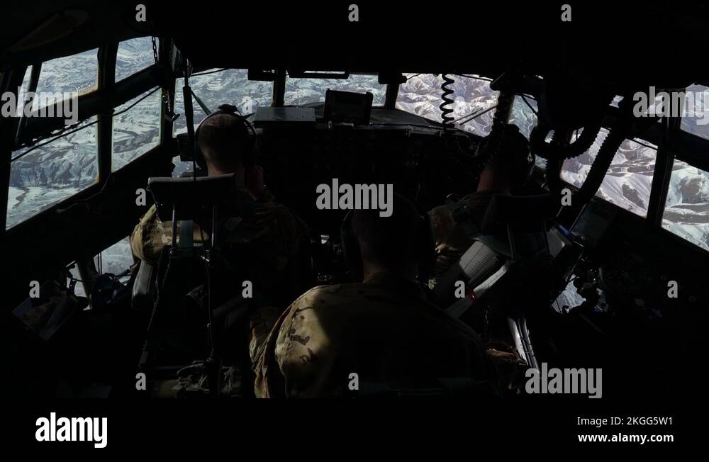 Cockpit footage of USAF C-130 Hercules in flight over mountains of ...