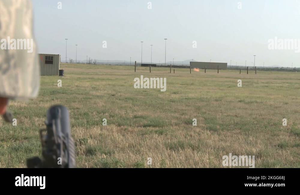 Soldier firing a grenade rifle in an open field Stock Video Footage - Alamy