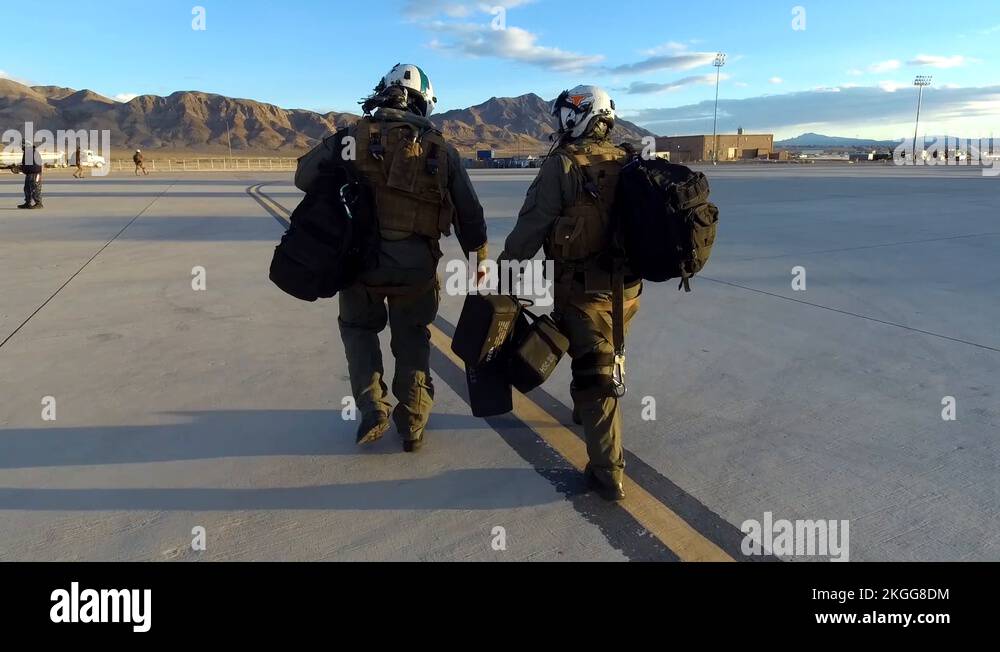 MH-60 Seahawk pilots walking across airstrip at Nellis, Nevada during ...