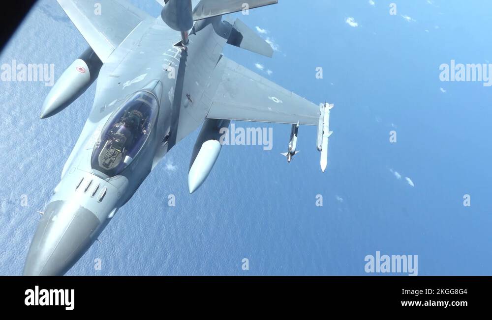 KC-135 boom connecting with F-16 Viper for aerial refueling above ...