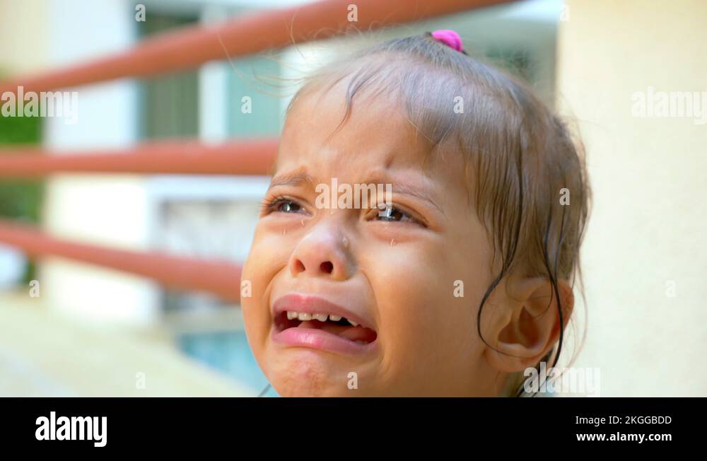 Closeup, portrait Little cute Asian girl crying with tears on her face ...