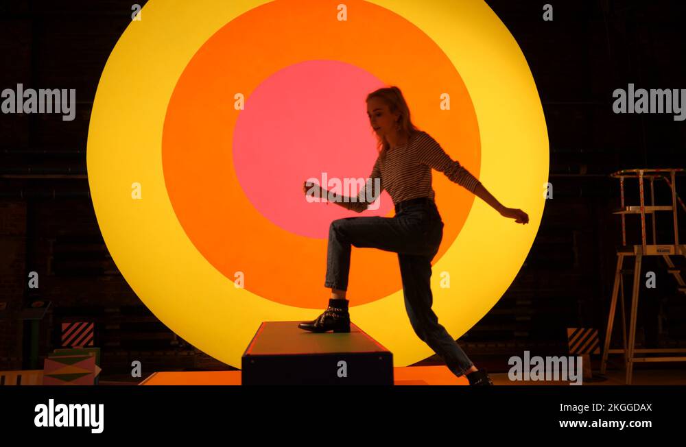 010 Model young girl silhouette posing on bright colorful background ...