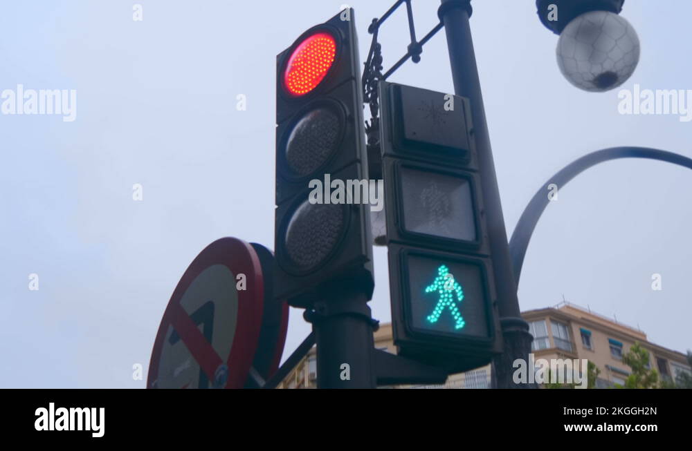 Traffic lights on the street in the city of Spain with red and green ...