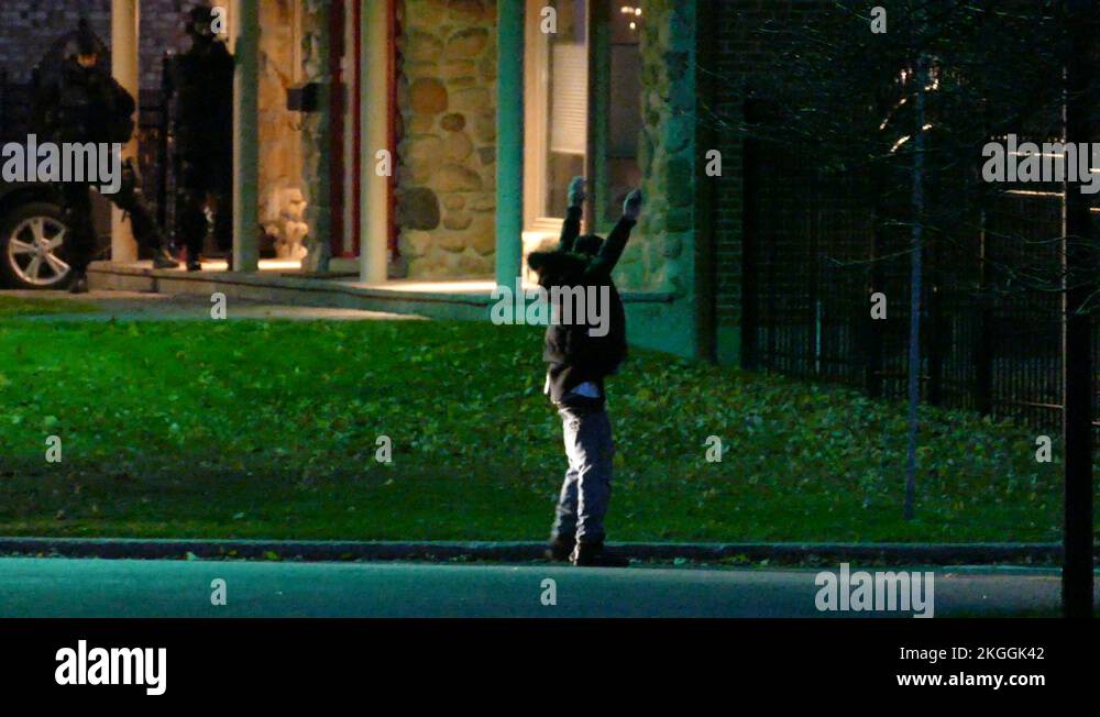 White male suspect walking backwards at standoff with swat cops behind ...