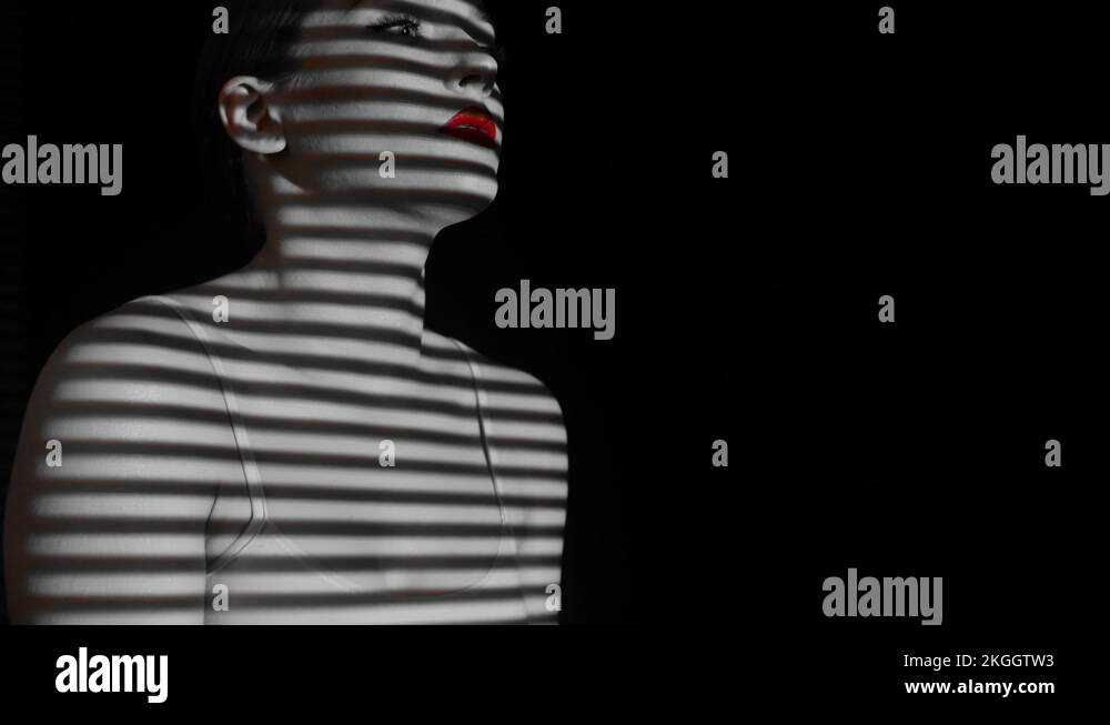 Projection of black and white lines on the girl’s face and body Stock ...
