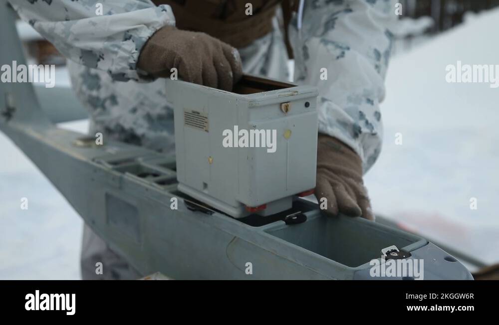 Soldier fitting battery to RQ-20 Puma unmanned aerial vehicle UAV Stock ...