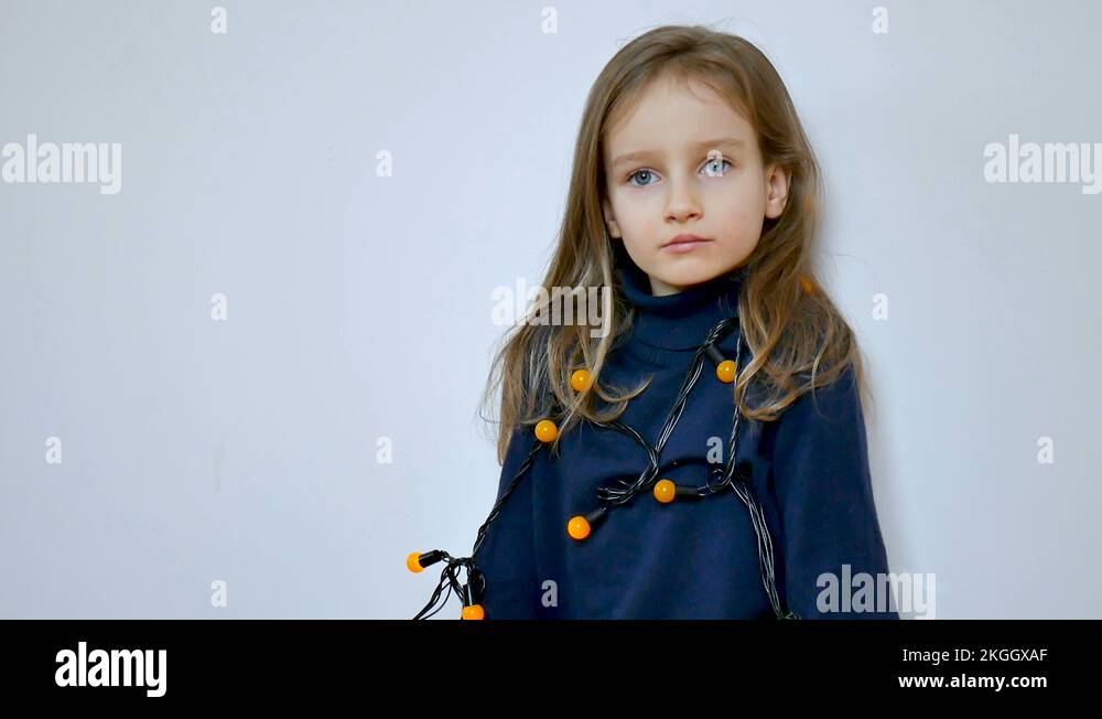 Cute female child with long blonde hair and big blue eyes wearing bunch ...