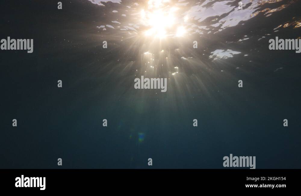 sun shine sun beam sun rays underwater surface of sea waves Stock Video ...