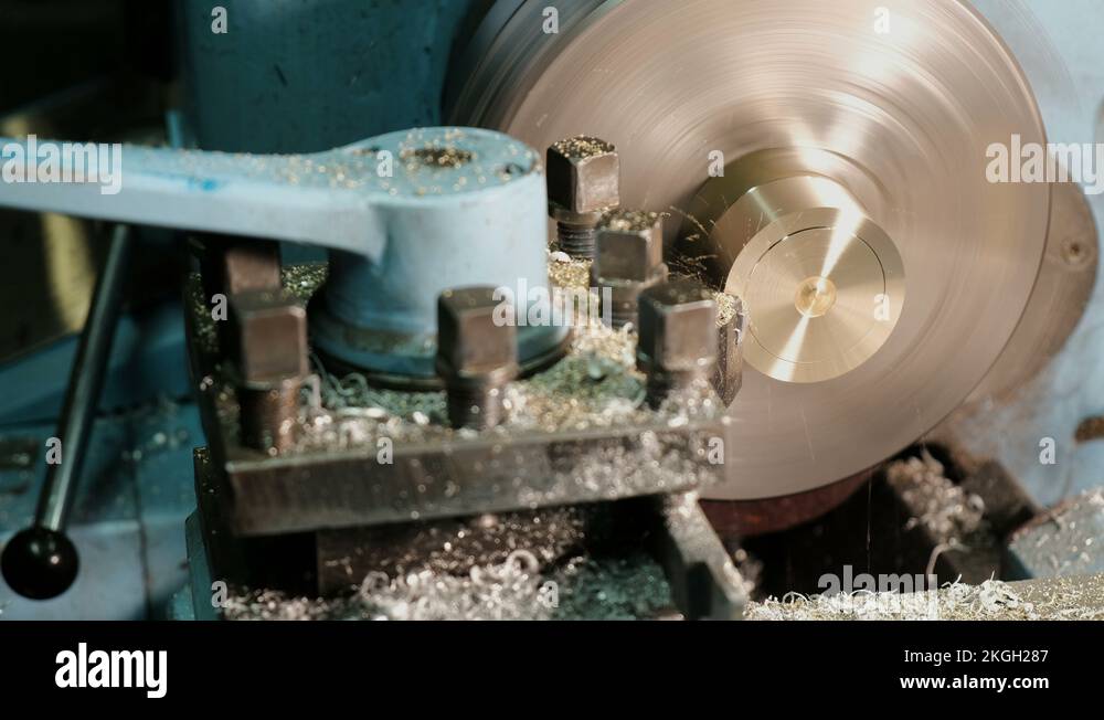 Facing operation of a brass blank on turning machine with cutting tool ...