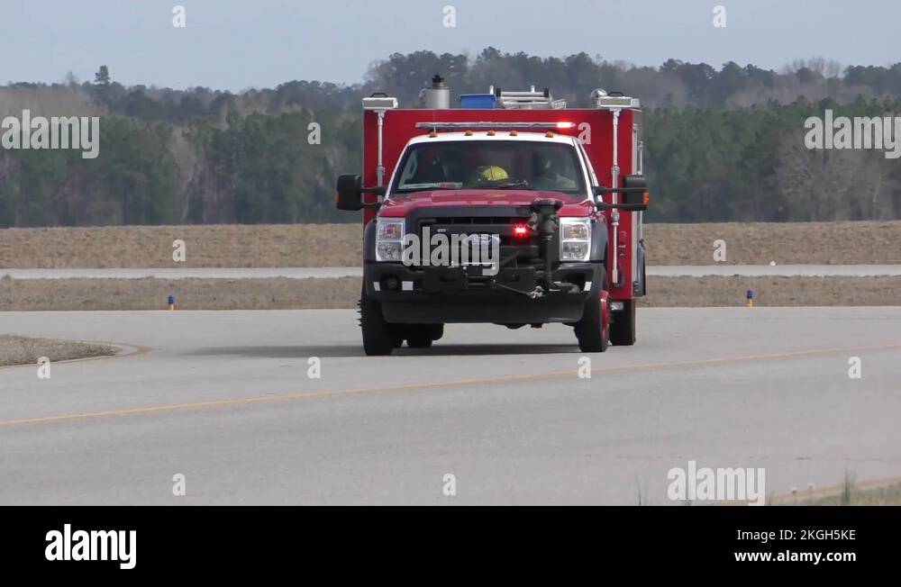 U.S. Air Force fire trucks being driven along airstrip Stock Video ...