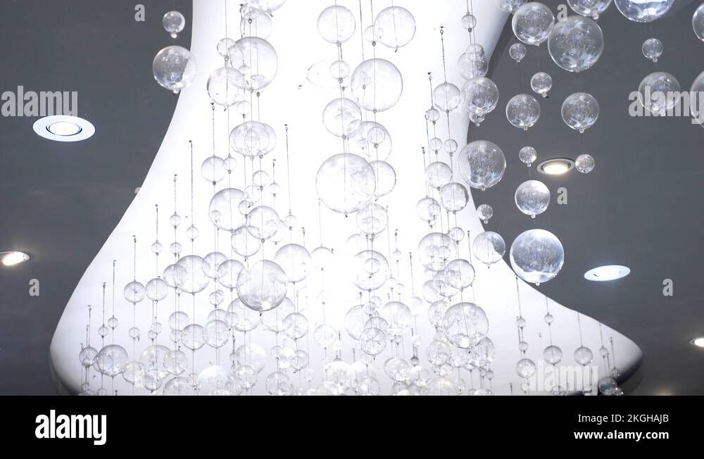 a lot of modern beautiful clear glass ceiling lights on a modern ...