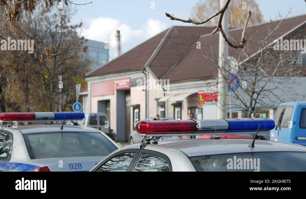 Two Police cars with emergency vehicle lighting during traffic ...
