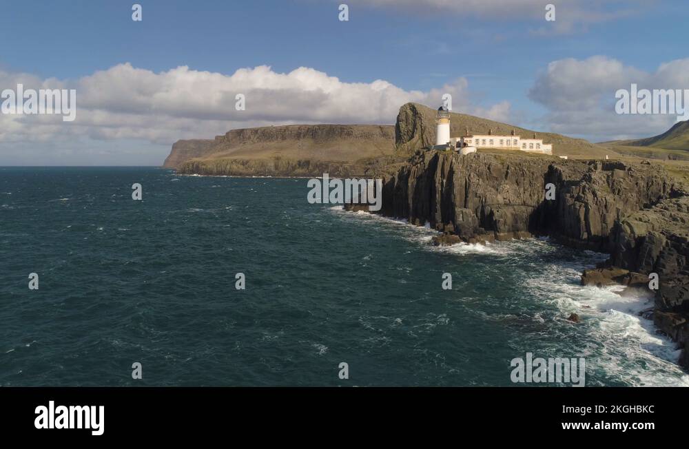 Lighthouse on the edge of cliff . Neist Point, Skye drone aerial 4K ...