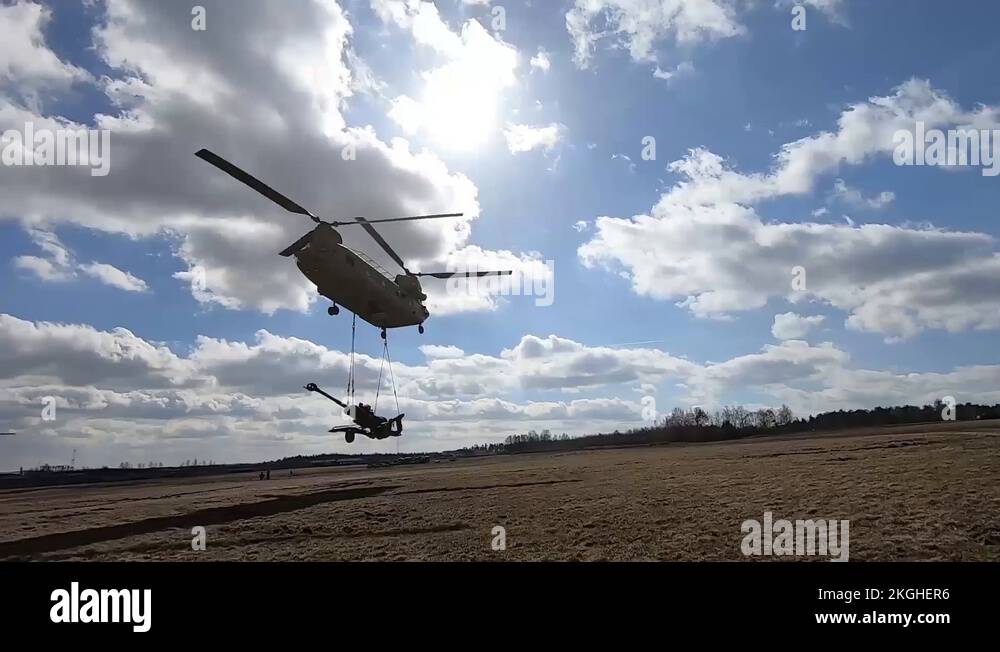 CH-47 Chinook hovering with M777 Howitzer during air assault mission Stock Video Footage - Alamy