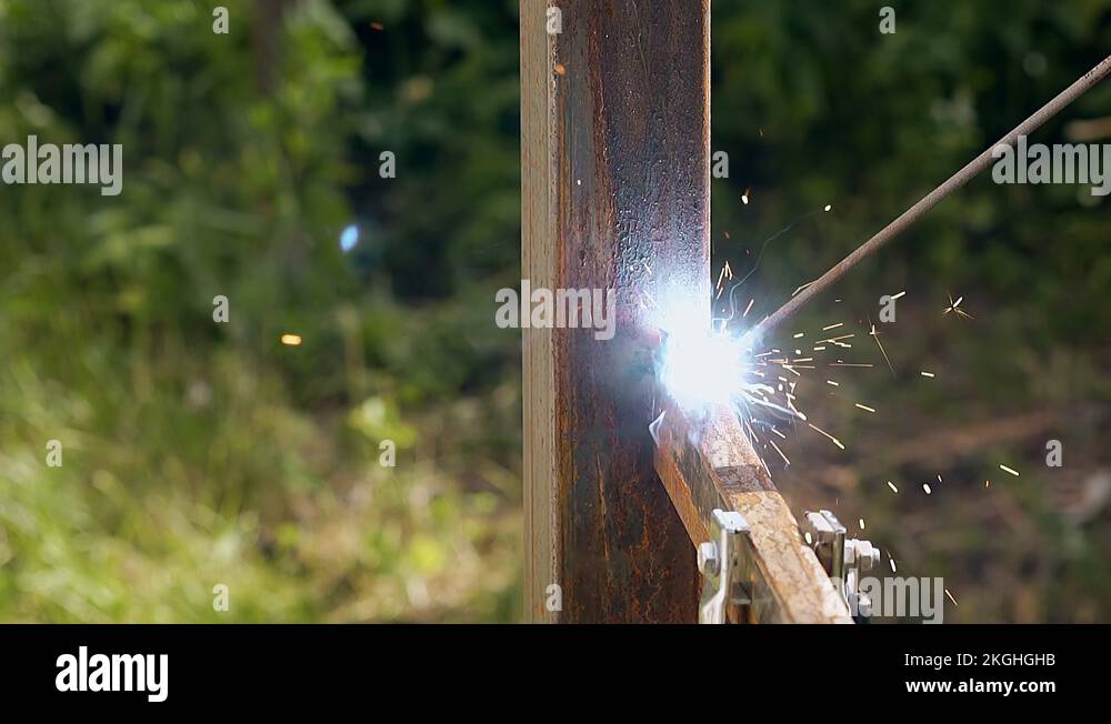 close view plank connected to pole with welding machine Stock Video ...