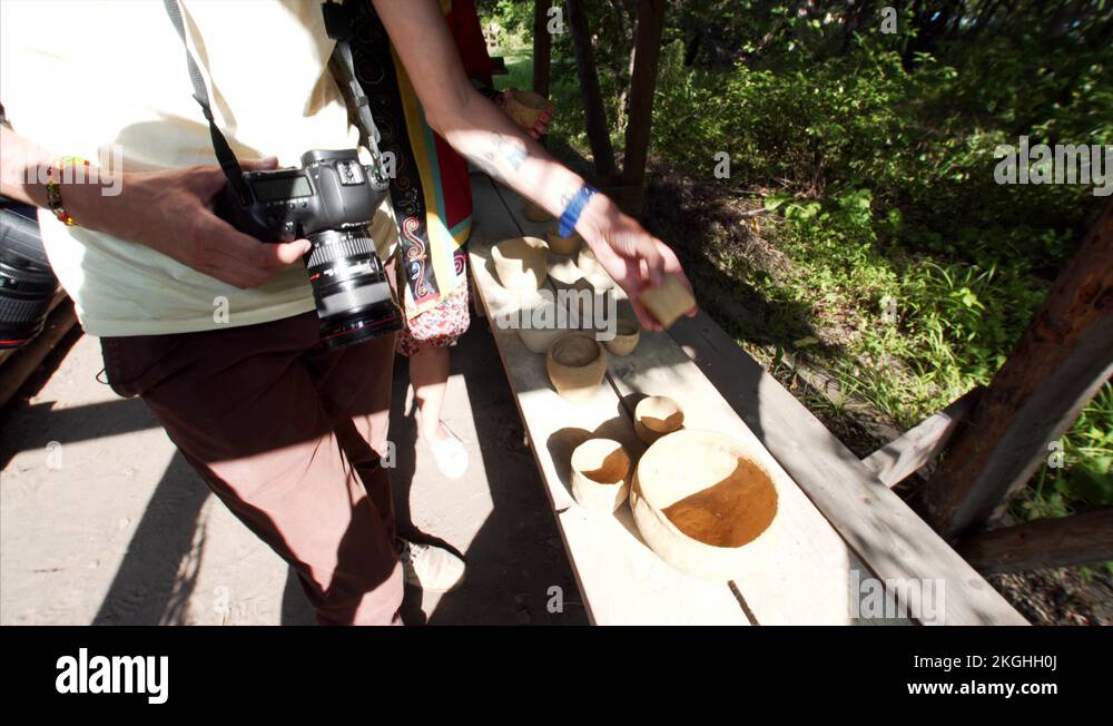 Man with camera is taking and exploring ceramics made by ancient people ...