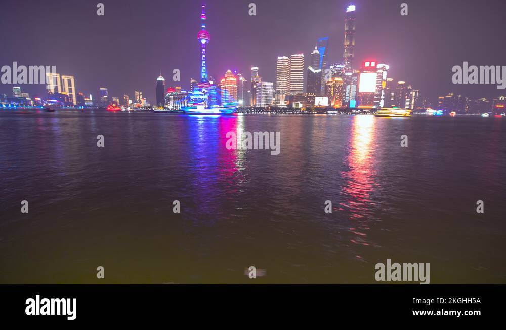 Shanghai skyline night view from the bund, tilt up time lapse clip ...