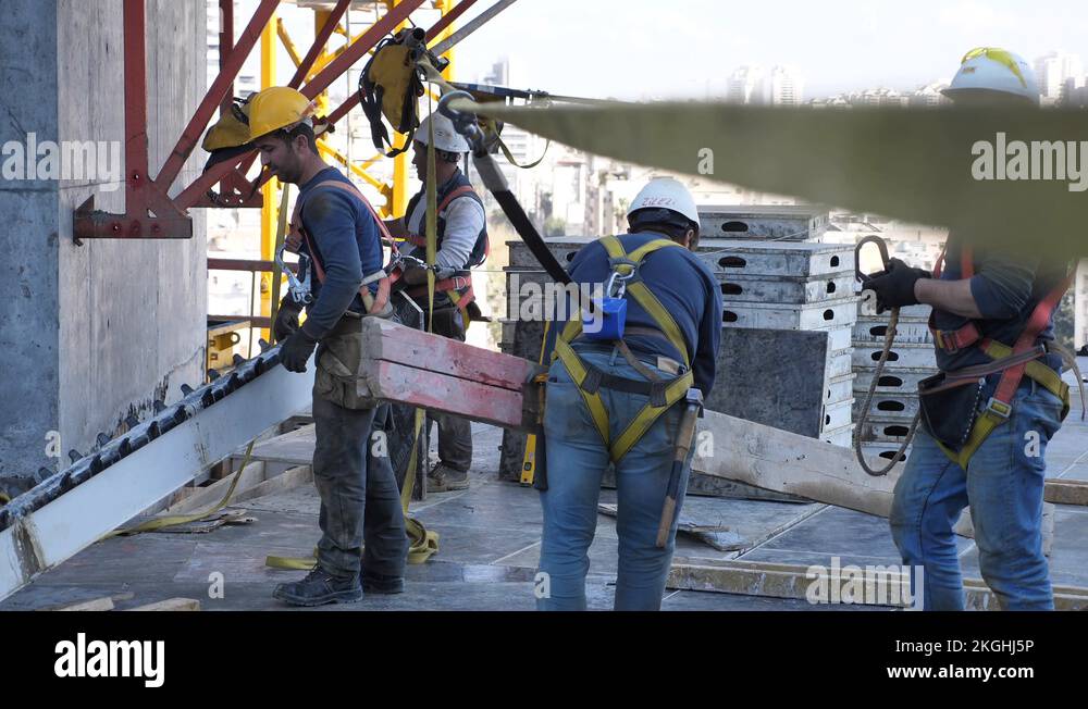 Construction workers connected to safety harness Stock Video Footage ...