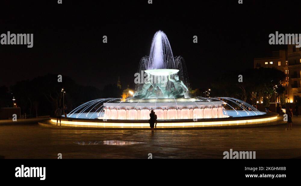 People around Iconic Triton fountain entrance fortified medieval city ...