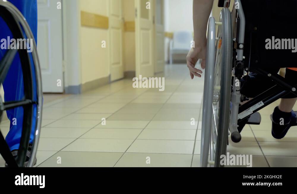 Young guy, a disabled person with a lesion of the spinal cord and legs ...