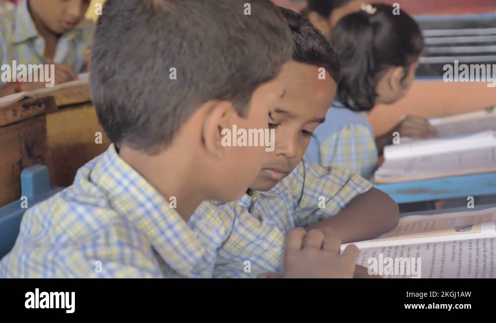 Students reading a lesson from the book in their class Stock Video ...