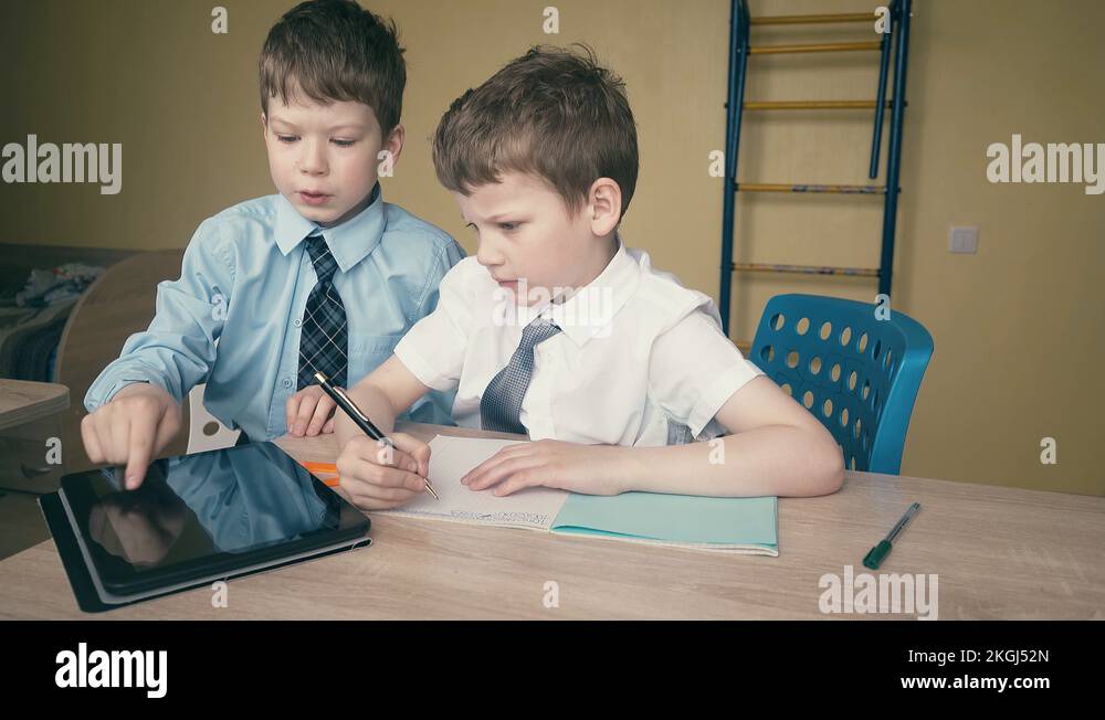 Pupils do homework, write numerals in notebooks, help each other Stock ...