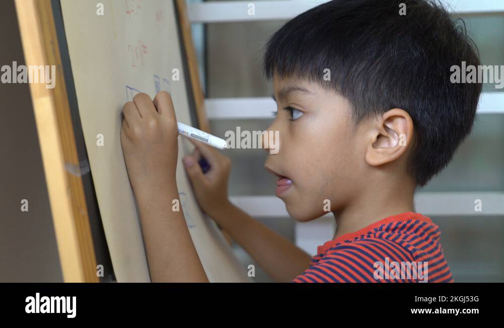 Asian boy writing Stock Videos & Footage - HD and 4K Video Clips - Alamy