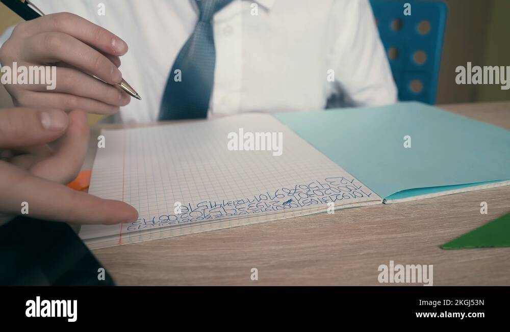 Schoolchildren do homework, write numerals in notebooks, help each ...