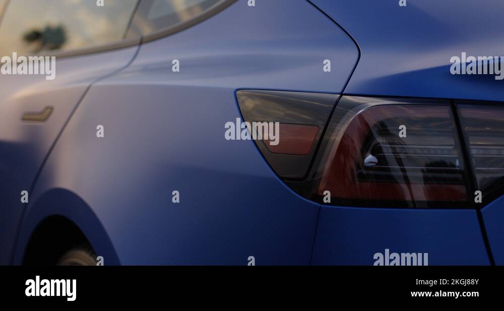 Tesla charging woman Stock Videos & Footage - HD and 4K Video Clips - Alamy