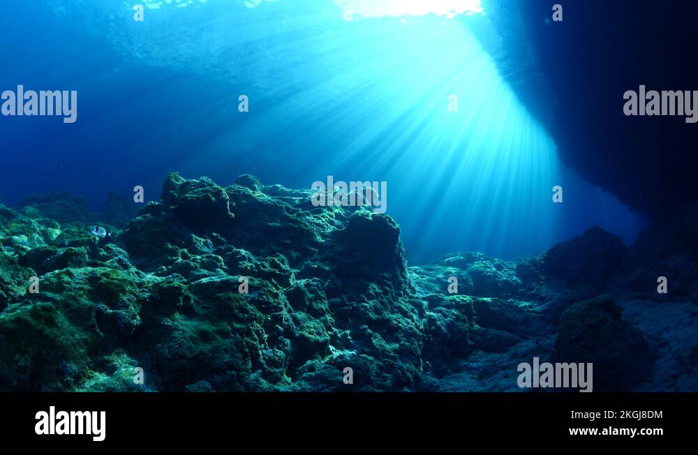 light underwater sun shine rays and beams dark cave deep water for ...