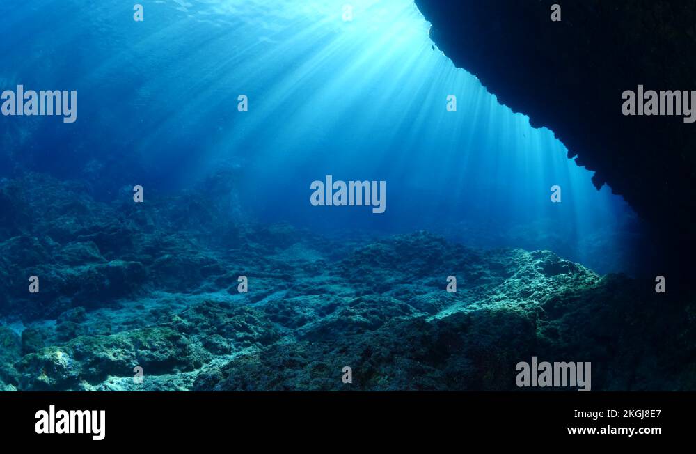 light underwater sun shine rays and beams dark cave deep water for ...