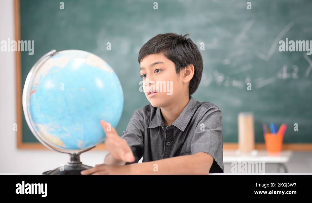 Student boy learning geography earth map in the classroom Stock Video ...