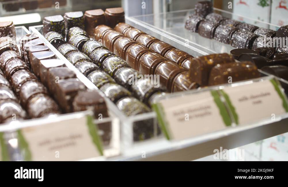 Assorted chocolates on display at a chocolatier Stock Video Footage - Alamy