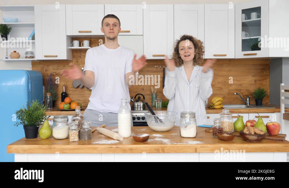 Young Happy Couple Dancing Together In Kitchen While Cooking Breakfast ...