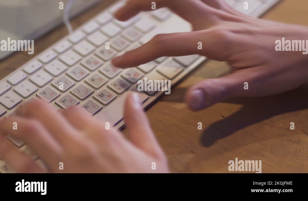 Man typing messages in chat and social networks or writing codes by the ...