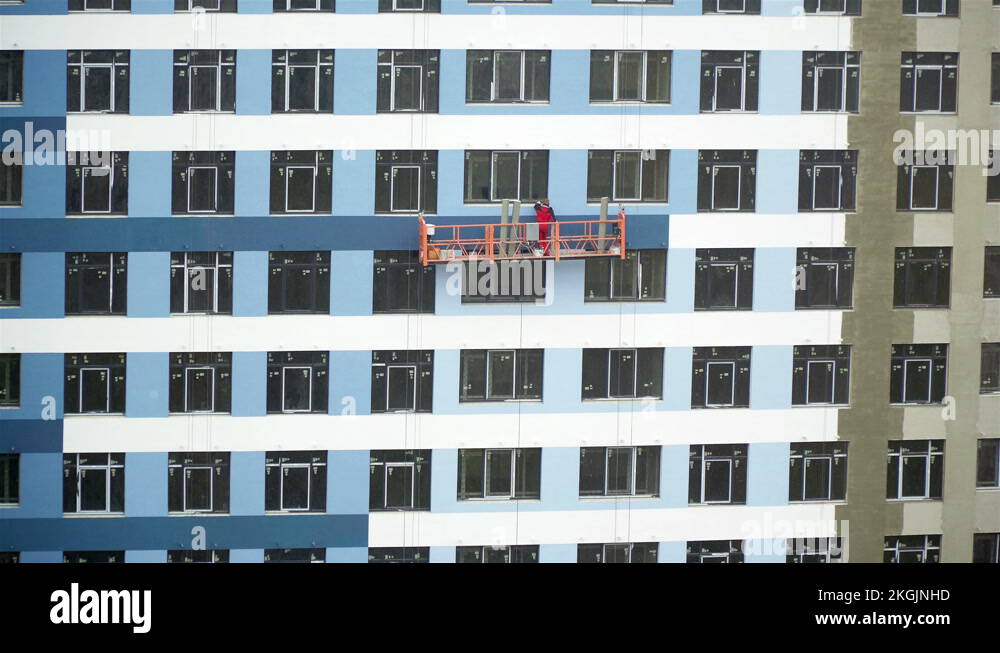 Builder paints facade building construction Stock Videos & Footage - HD ...