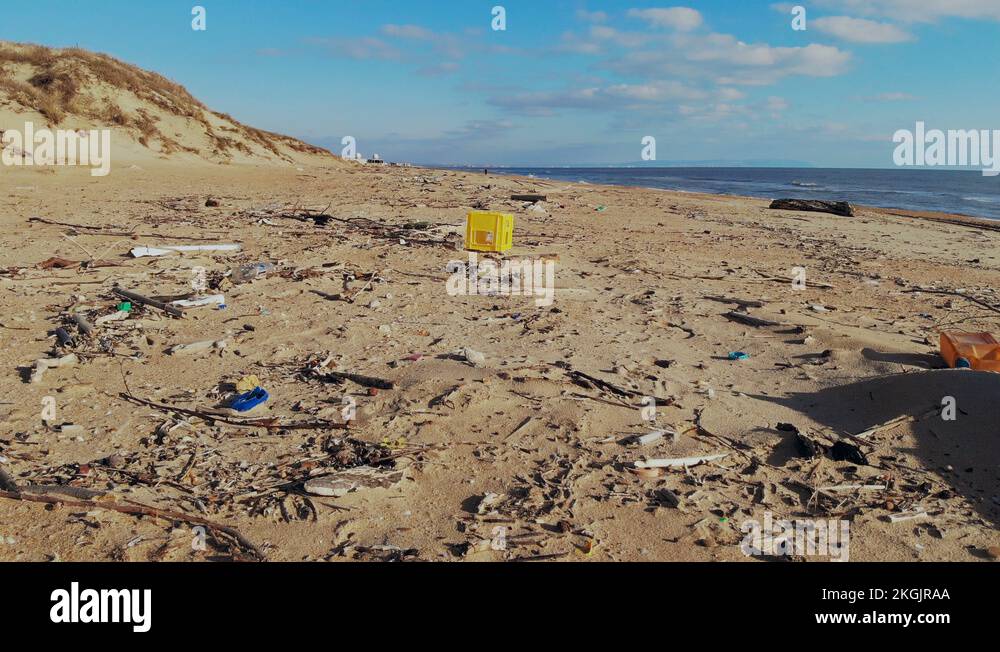 Plastic pollution on beach and in ocean. Aerial view of garbage on the ...