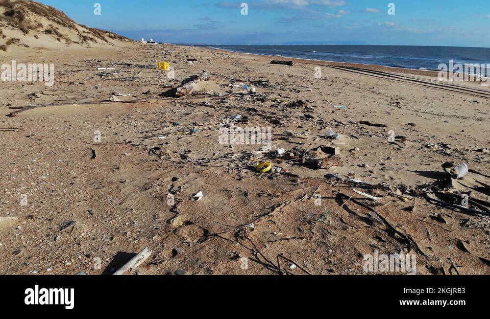 Plastic pollution on beach and in ocean. Aerial view of garbage on the ...