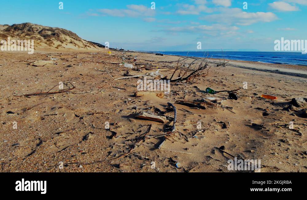 Plastic pollution on beach and in ocean. Aerial view of garbage on the ...