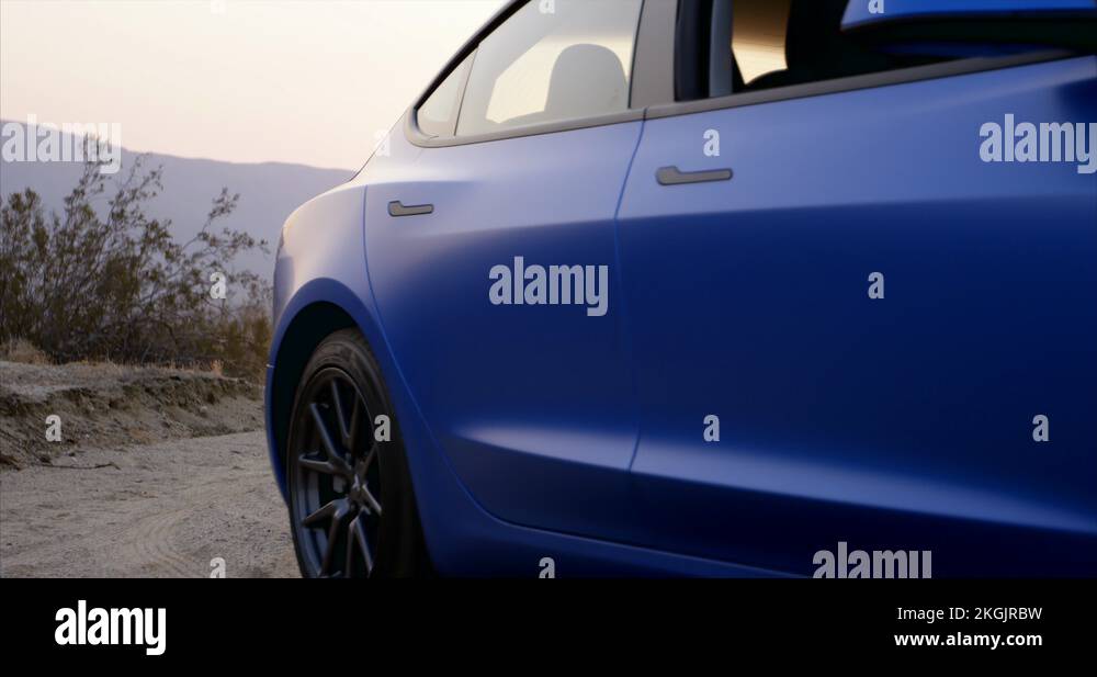 Tesla model 3 car on side of desert highway - leaving frame Stock Video ...