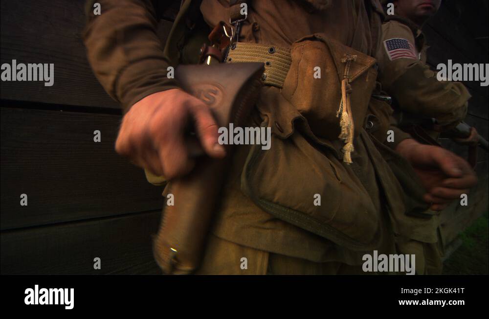 WW2 U.S. Army Airborne charge a French village with an M1911 Pistol Stock Video Footage - Alamy
