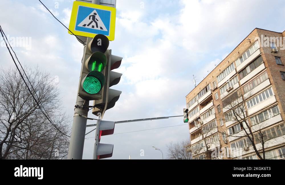 Traffic lights red, yellow, green, green arrow. Sign give way ...