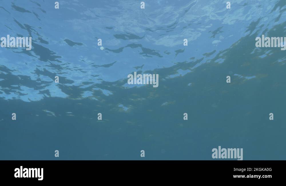 gun falling down from surface to sea bottom underwater Stock Video ...