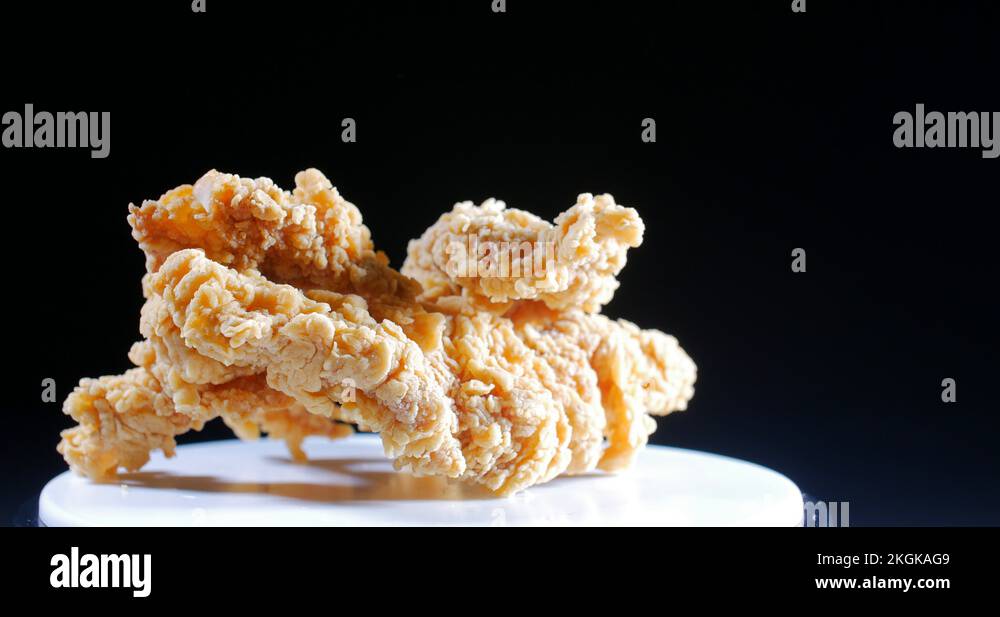 Piece of crispy fried chicken rotating Stock Video Footage - Alamy